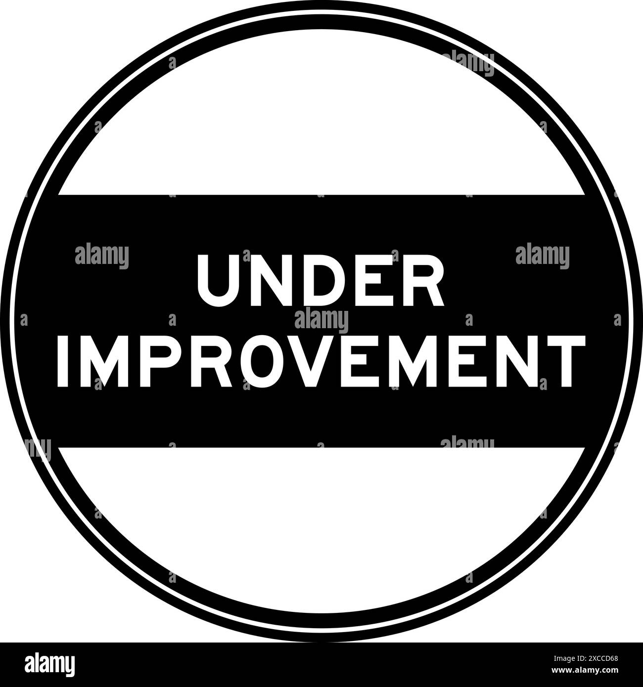 Black color round seal sticker in word under improvement on white ...