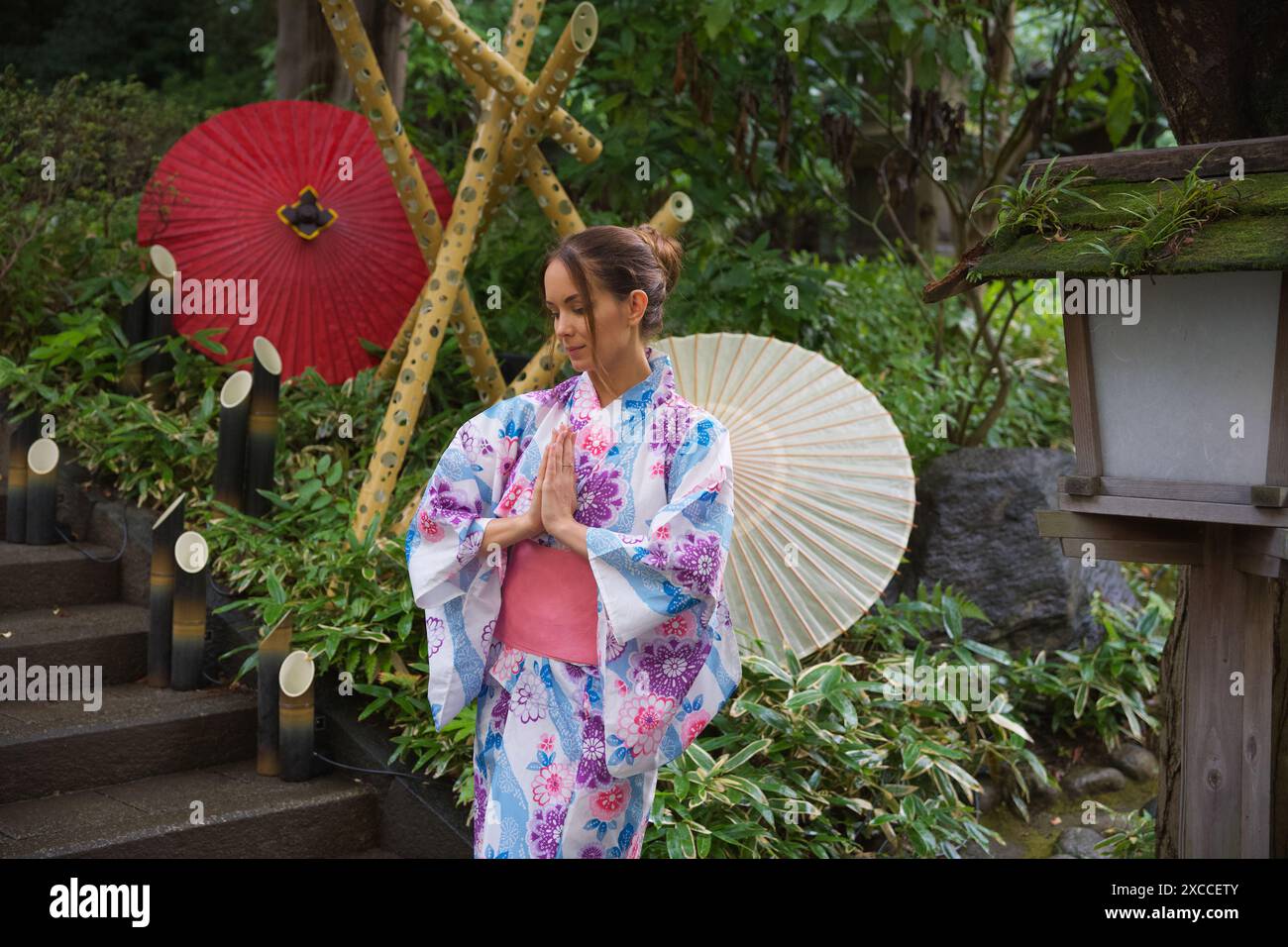 Girl in traditional Japanese clothing Yukata in a Tokyo park Stock ...