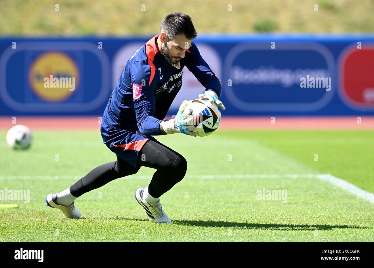 Neuruppin, Germany. 16th June, 2024. Croatia Goalkeeper Ivica Ivusic is ...