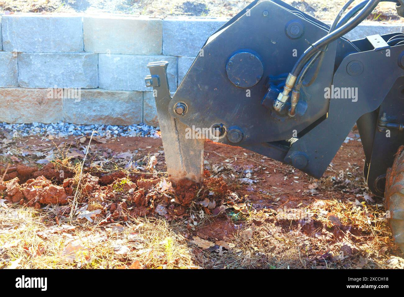An optical fiber cable is laid with aid of trencher cable plow tractor ...