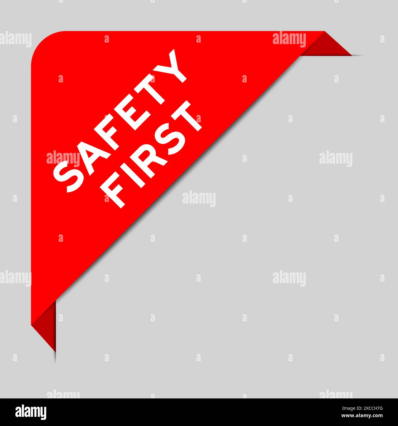 Red color of corner label banner with word safety first on gray ...