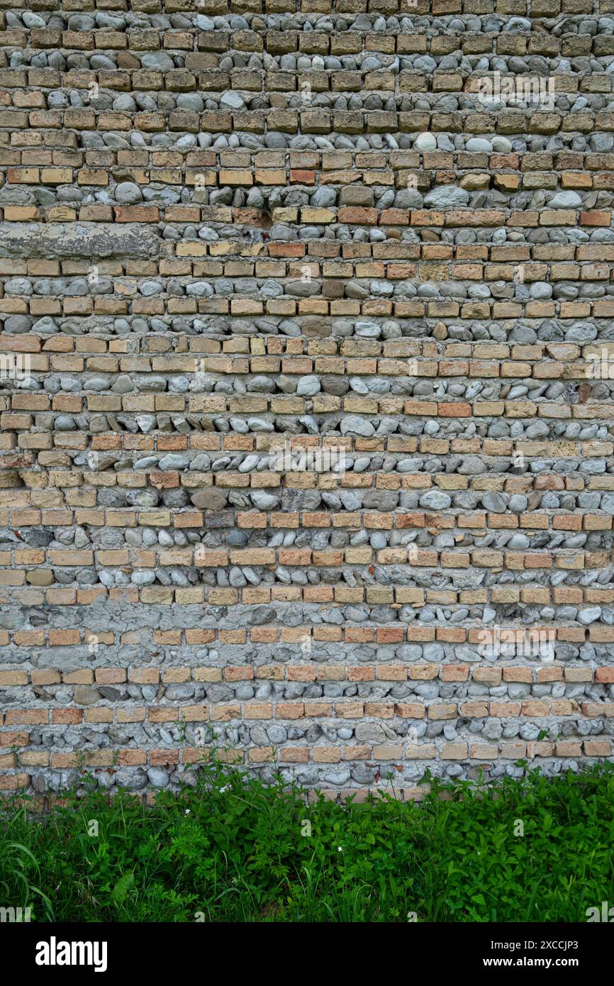 the pattern of bricks and stones of an old wall Stock Photo - Alamy