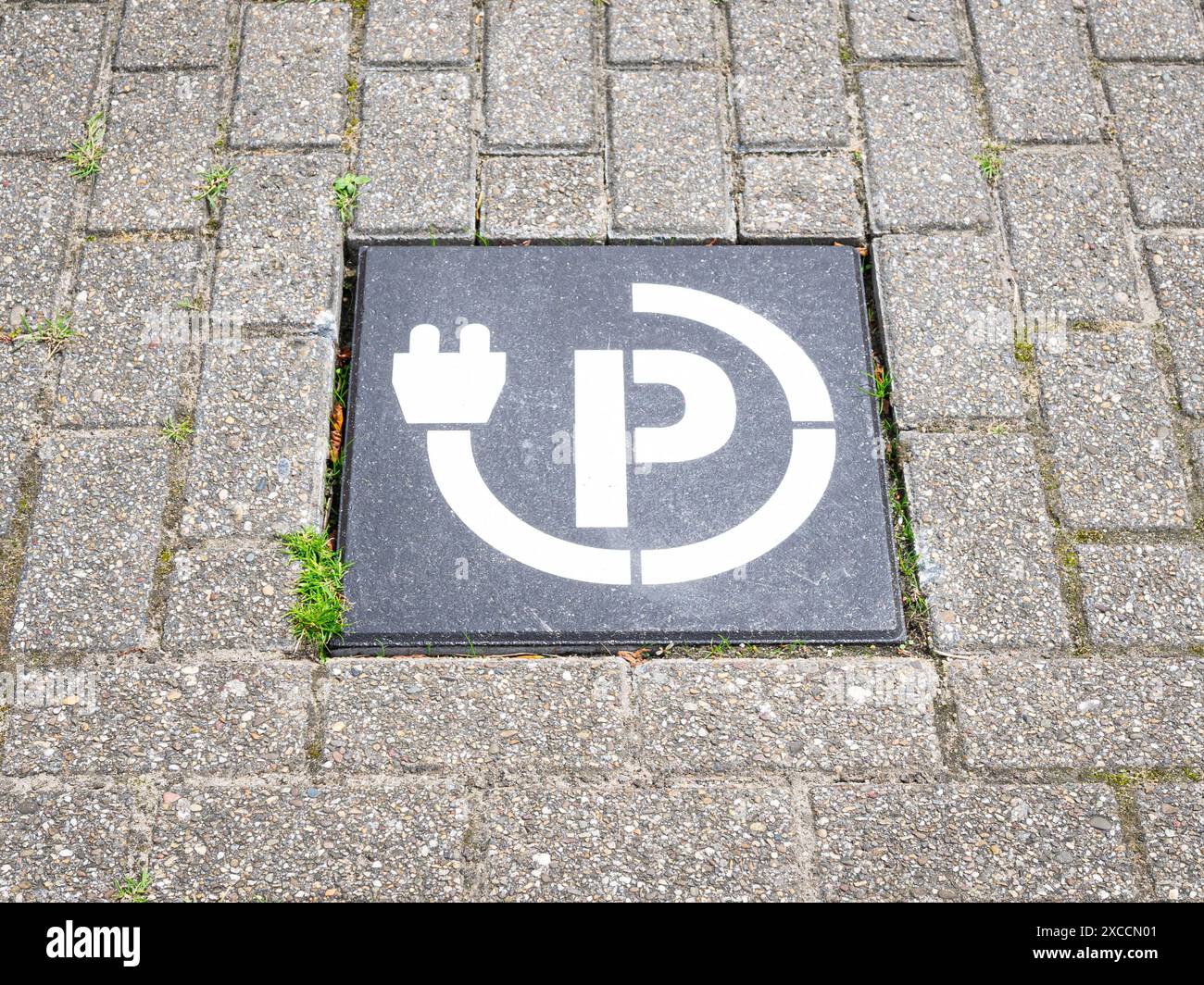 Painted symbol for a parking lot where you can charge your electric car ...