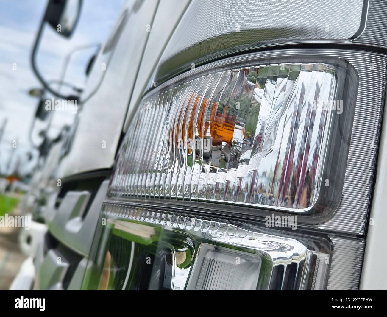 Big truck headlight with grille and hood Stock Photo - Alamy