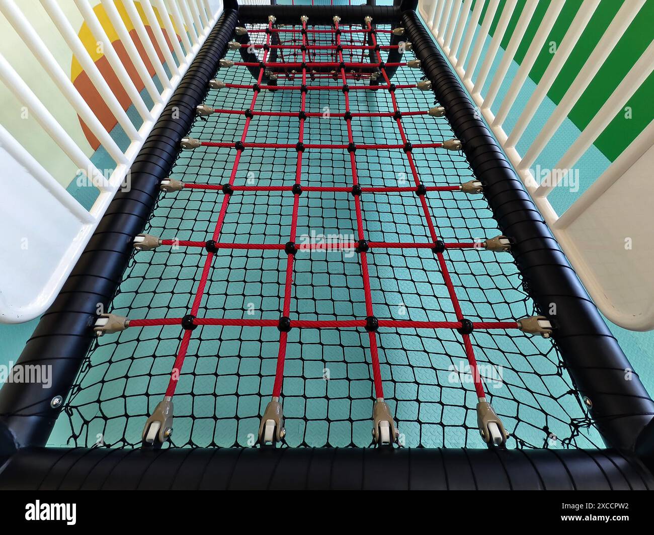 The trampoline features a mazepatterned surface for recreational use ...