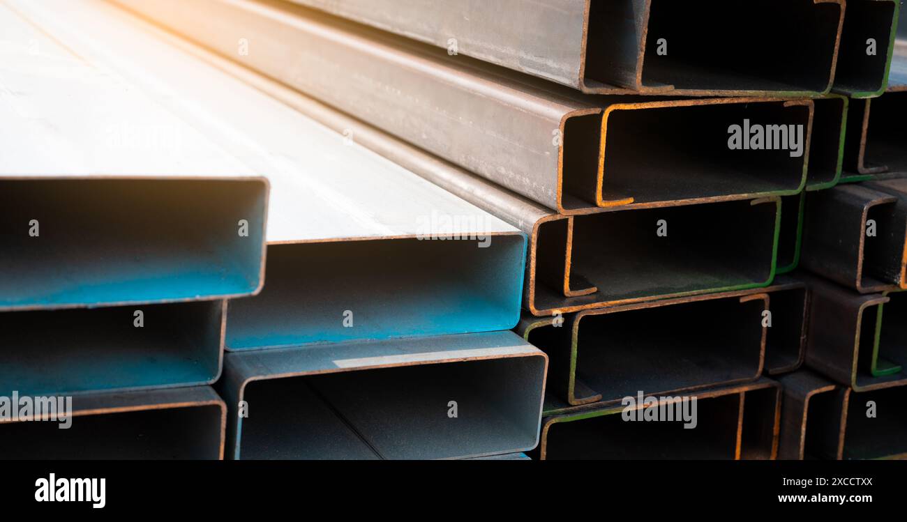 Industrial warehouse stock of rectangular metal pipes for building and construction supplies ...