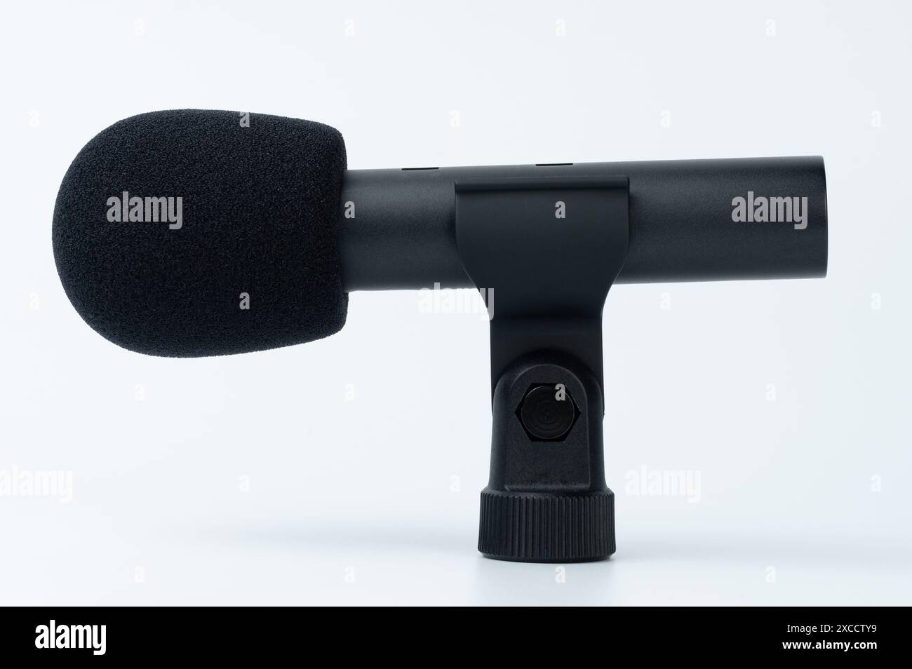 Black cylinder microphone in wind protection with holder isolated side ...