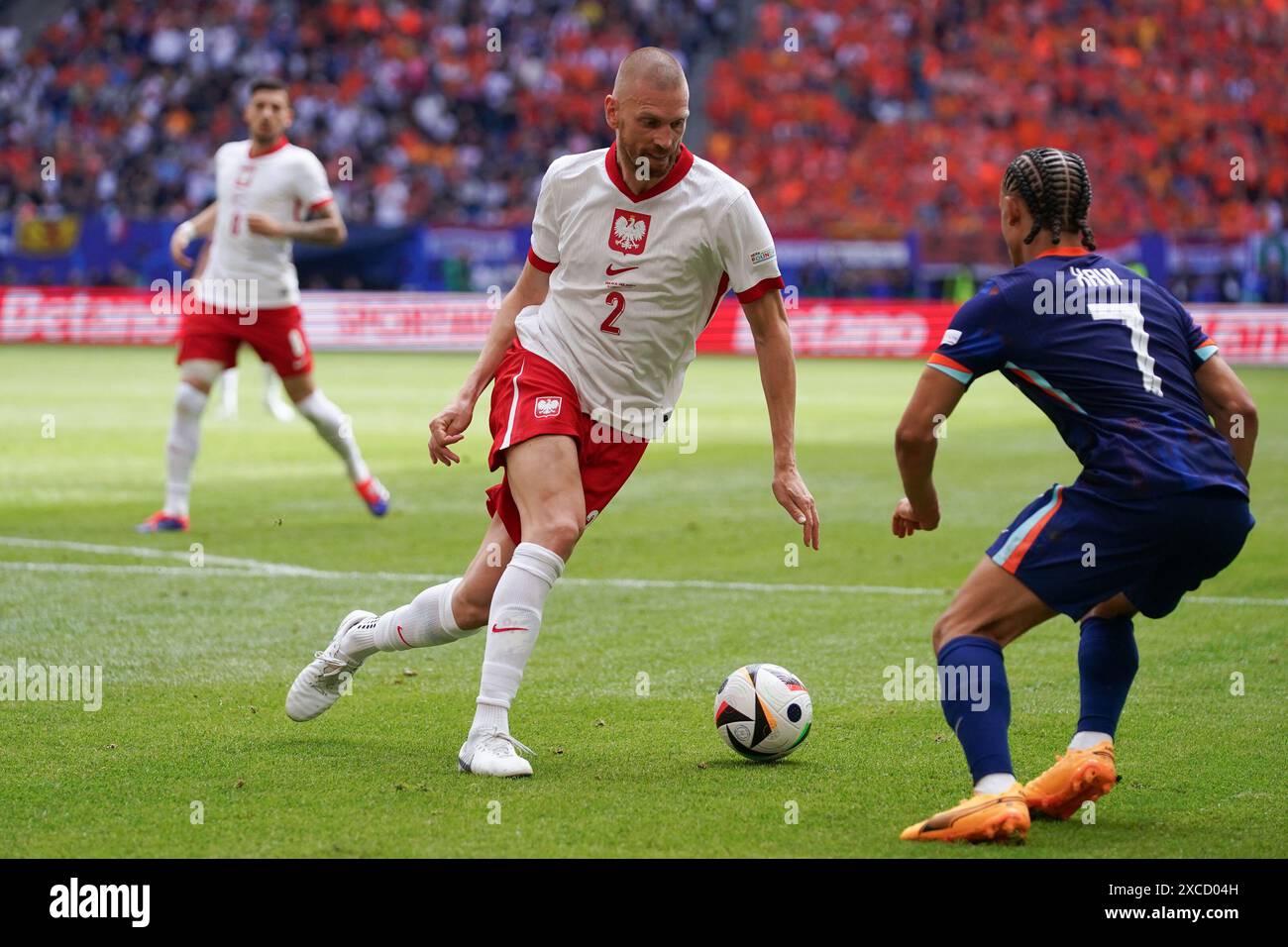 HAMBURG, GERMANY - JUNE 16: Bartosz Salamon of Poland battle for ...
