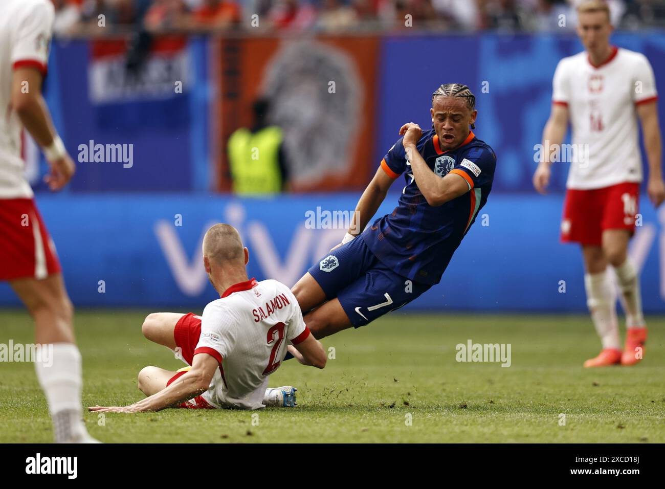 HAMBURG - (l-r) Bartosz Salamon of Poland, Xavi Simons of Holland ...