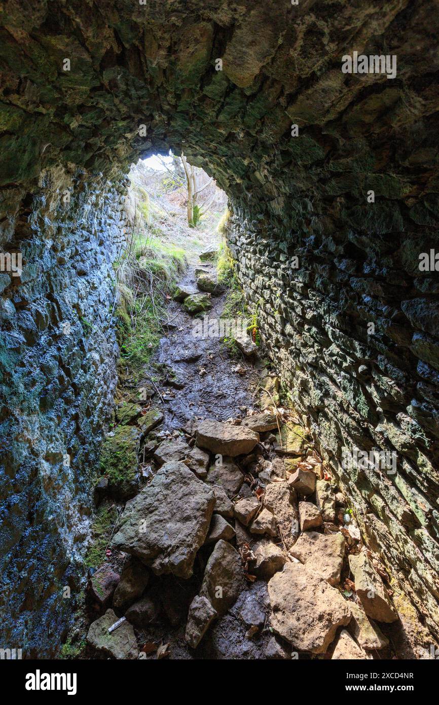 Inside a flue at the Roman lead mining remains, the Mineries, Somerset ...