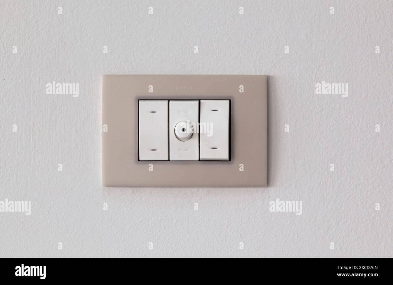 European style wall light switch on a white background. Three sections ...