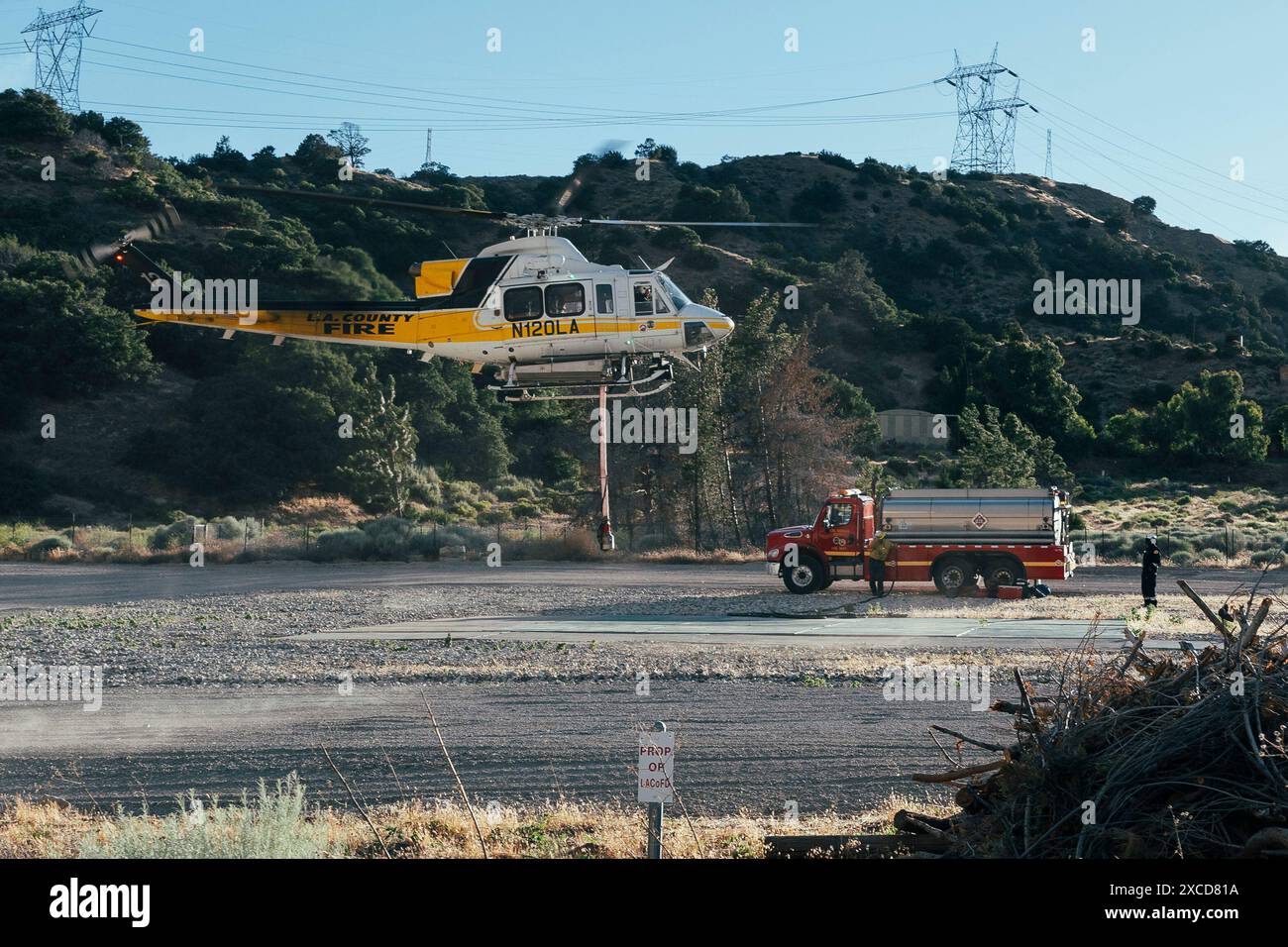 A Cal Fire helicopter prepares to be refilled with water. The Post Fire ...