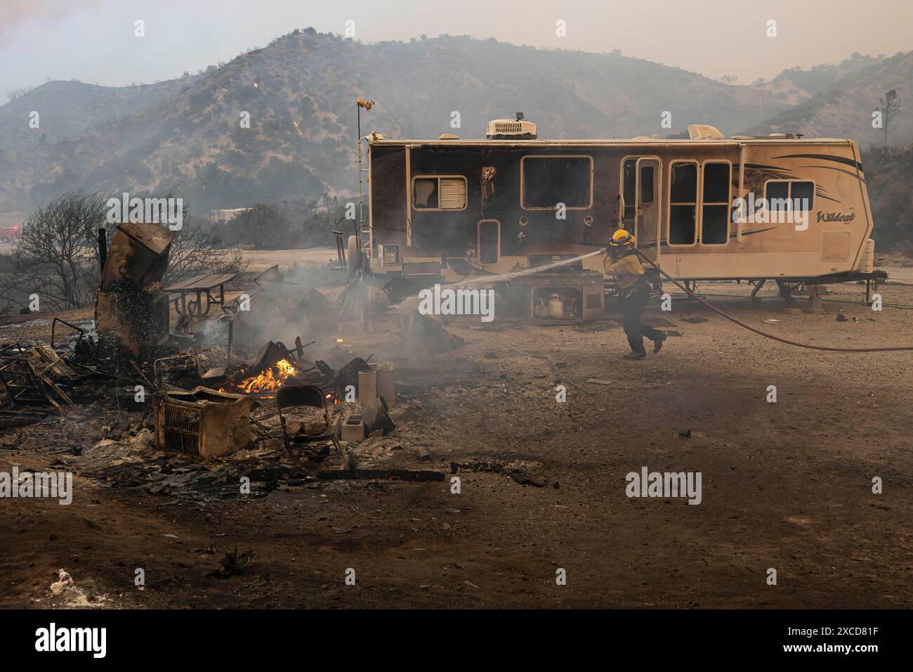 Fireman seen extinguishing a fire. The Post Fire consumes Gorman ...