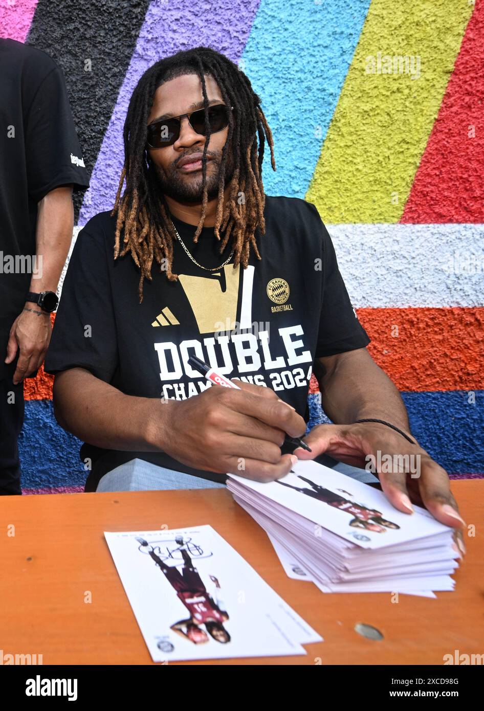 Munich, Germany. 16th June, 2024. Basketball player Devin Booker signs ...