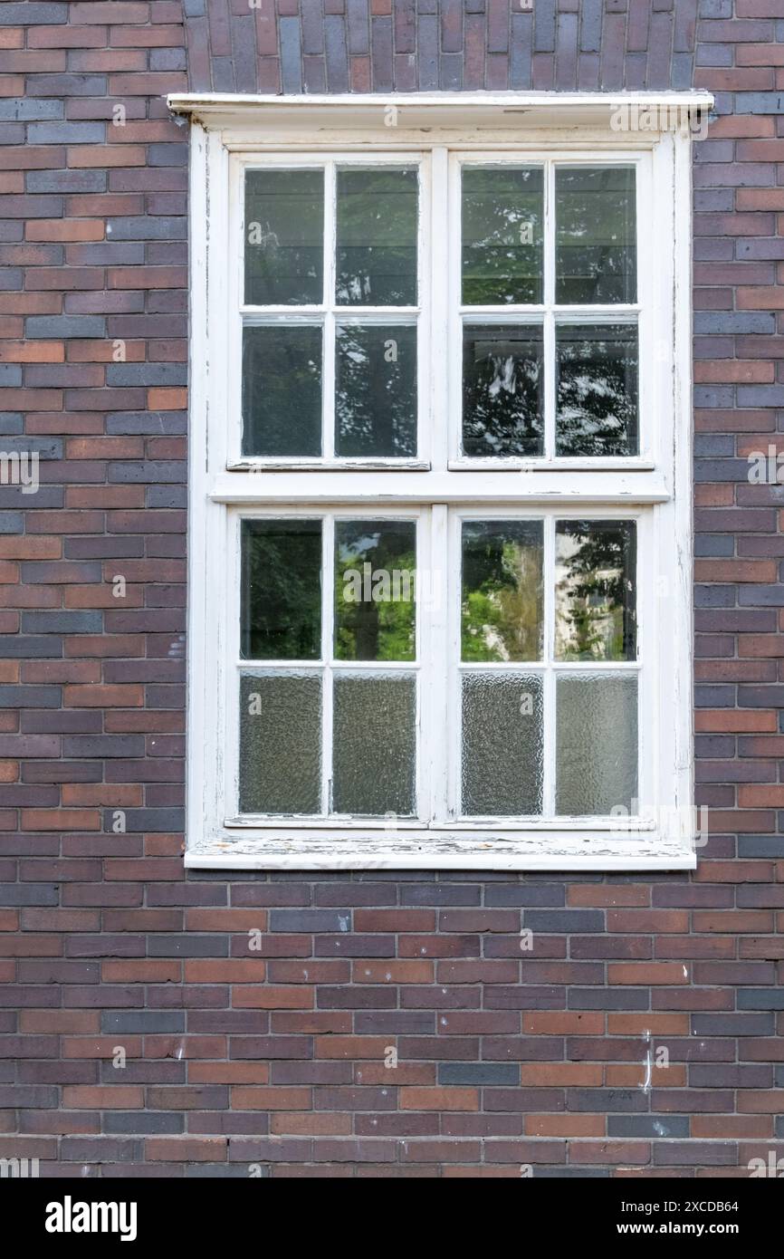 White mullioned window in brick wall Stock Photo - Alamy