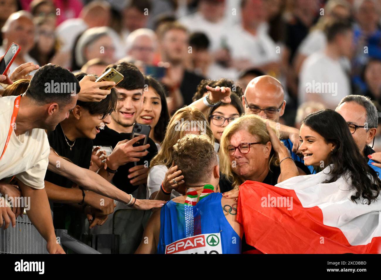 Alessandro Sibilio of Italy celebrates with parents after competing in ...