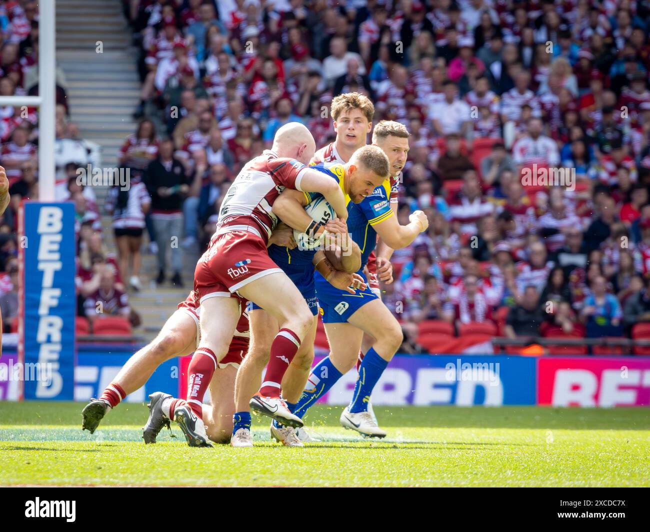 The 2024 Betfred Challenge Cup Final. Liam Farrell grabs Matt Dufty ...