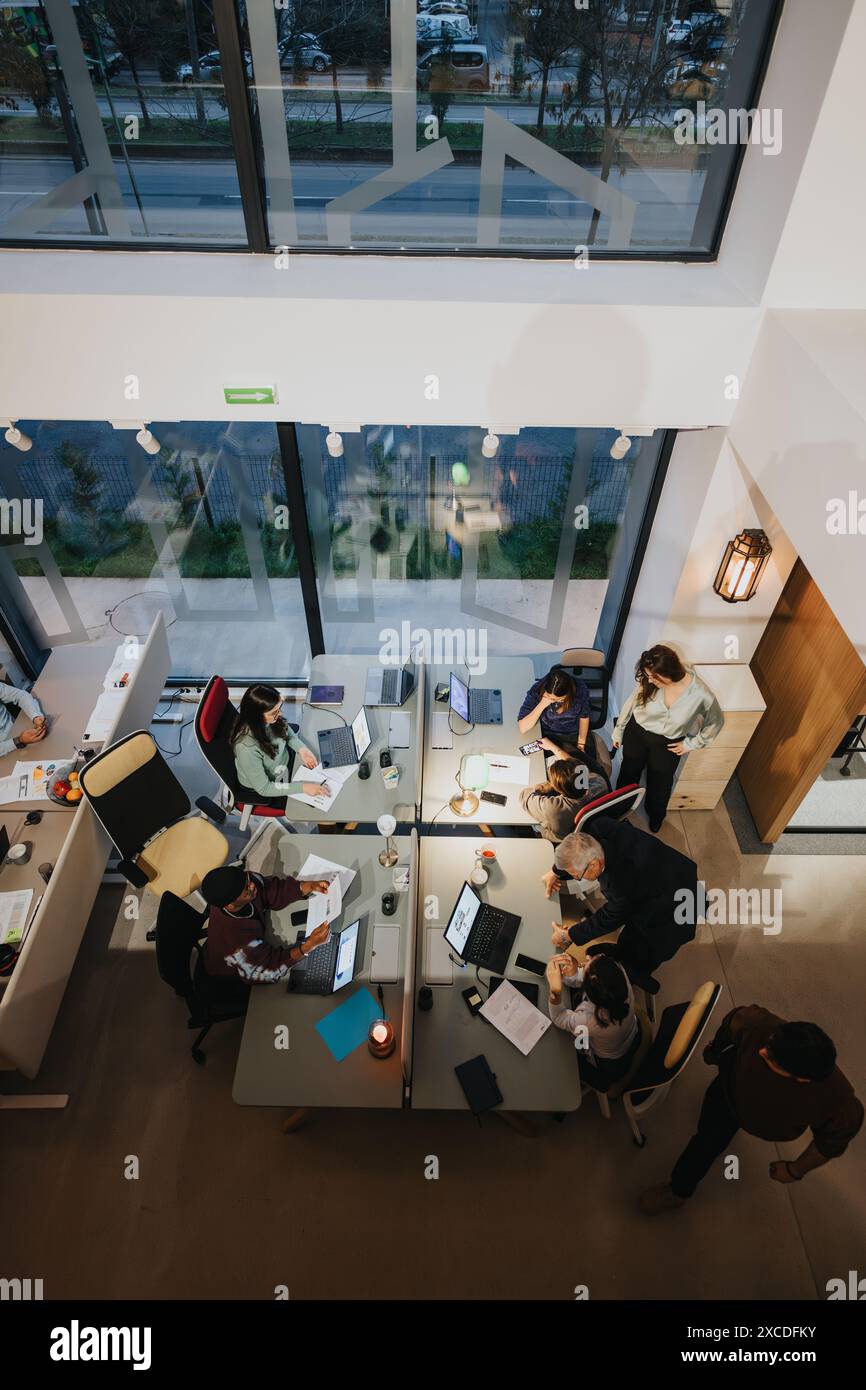 Aerial perspective of a group of colleagues engaged in a business ...