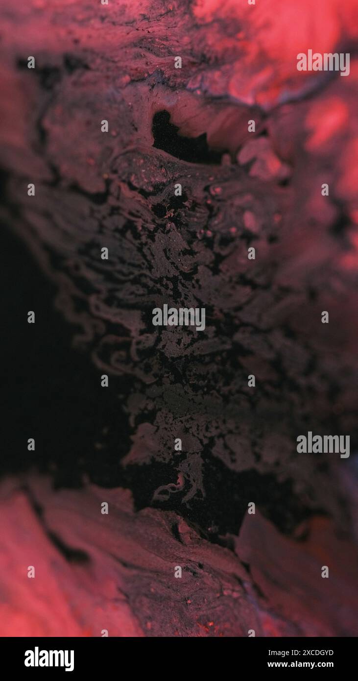 Shiny ink spill. Paint liquid. Blur black red color sparkling glitter sand particles acrylic ...