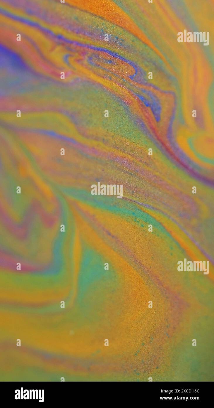 Shiny paint spill. Liquid marble. Blur orange purple turquoise color ...