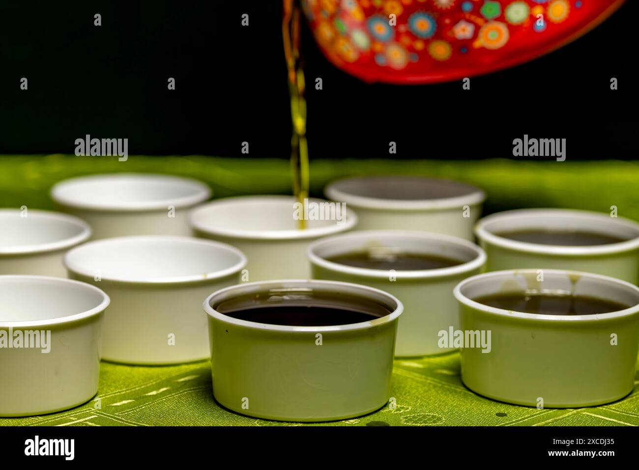 Making of marijuana healthy salve with black background and red cooking ...