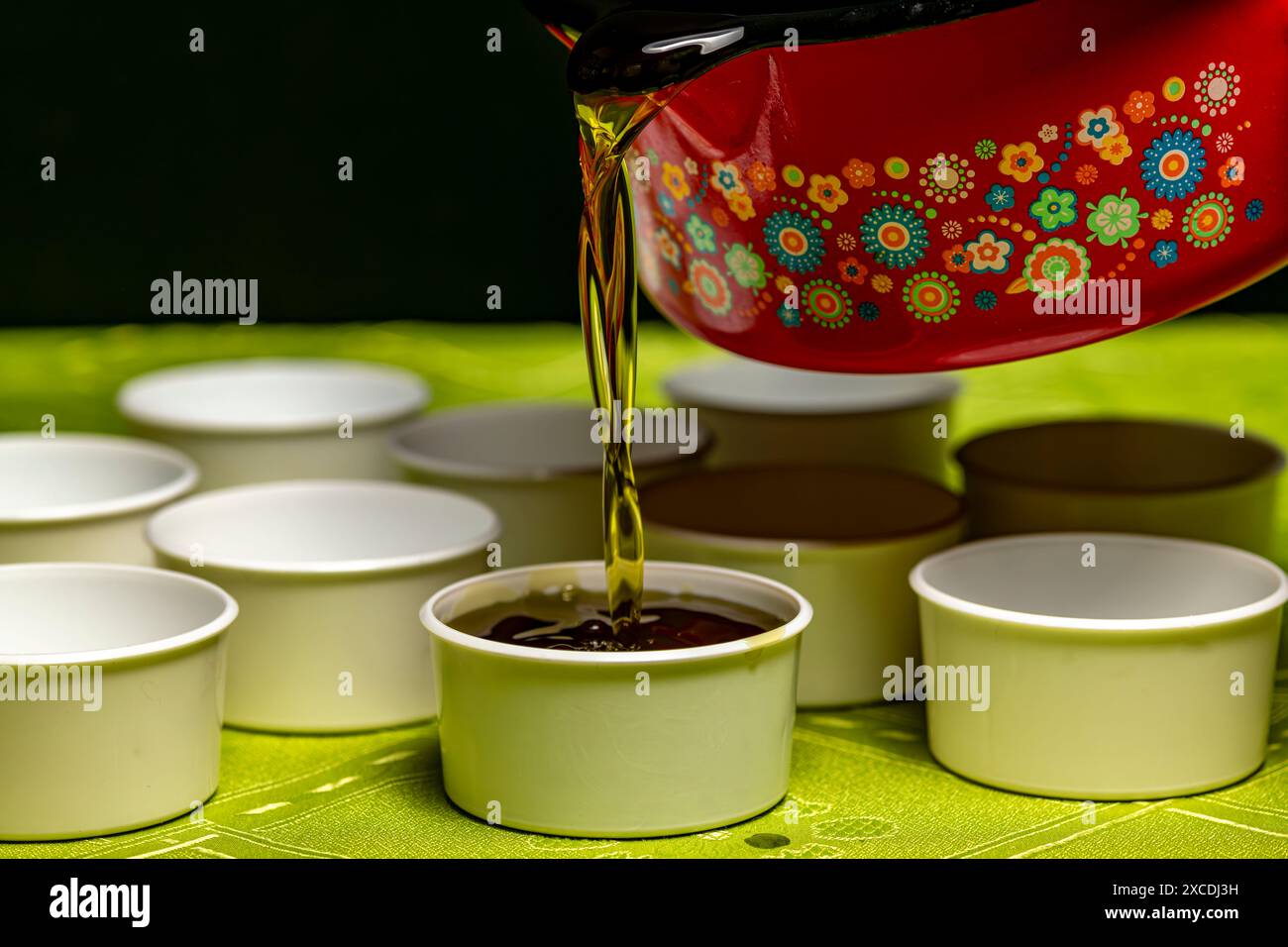 Making of marijuana healthy salve with black background and red cooking ...