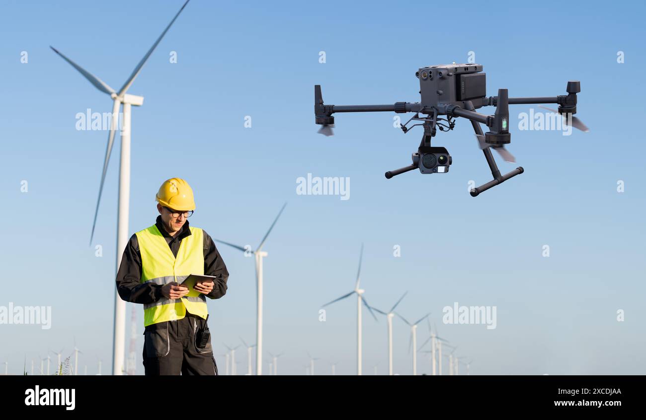 Engineer controls drone for wind turbines inspection Stock Photo - Alamy