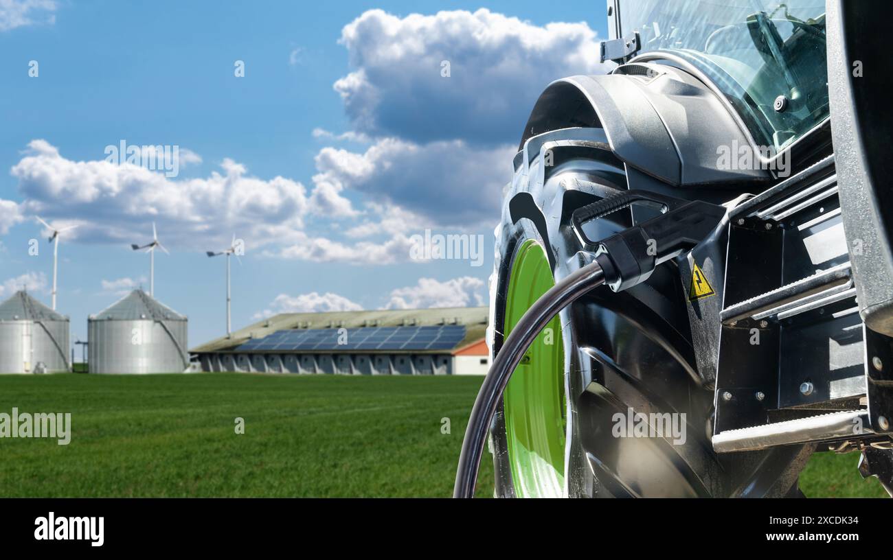 Electric agricultural tractor with connected charging cable. Concept ...