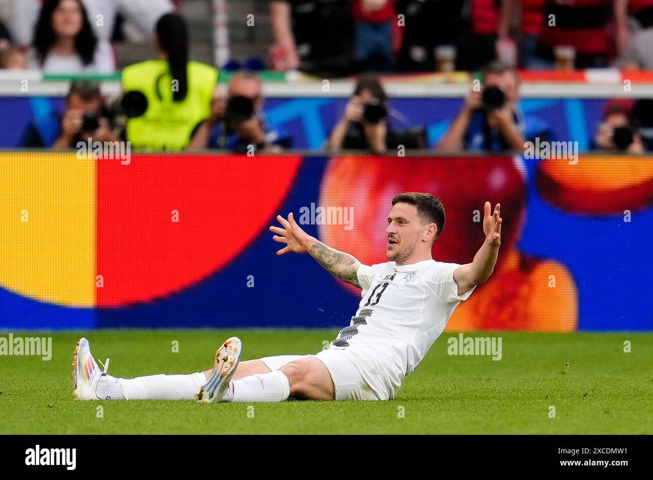 Slovenia's Erik Janza celebrates after scoring their side's first goal ...