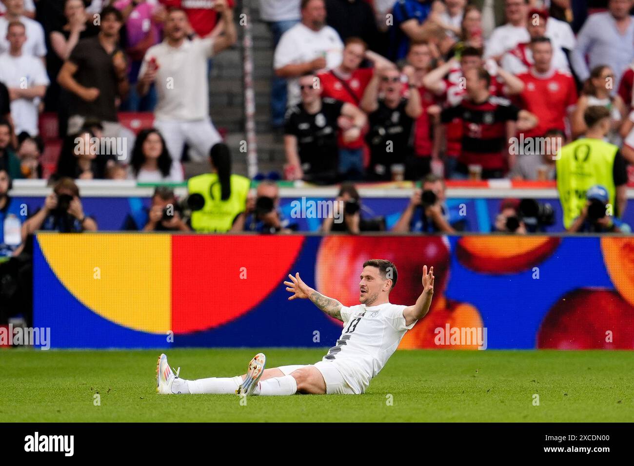 Slovenia's Erik Janza celebrates after scoring their side's first goal ...
