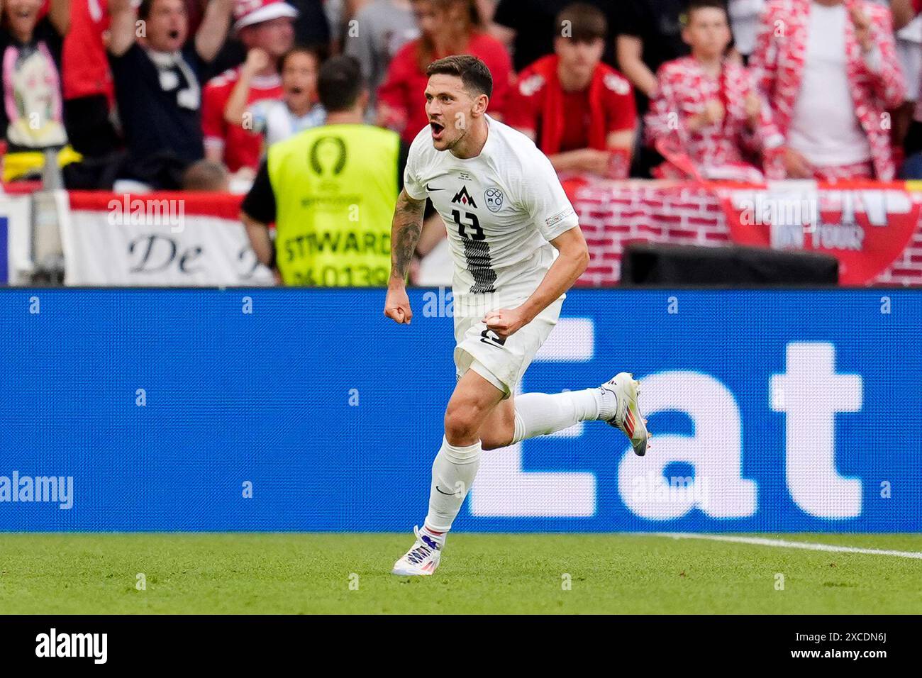 Slovenia's Erik Janza celebrates after scoring their side's first goal ...