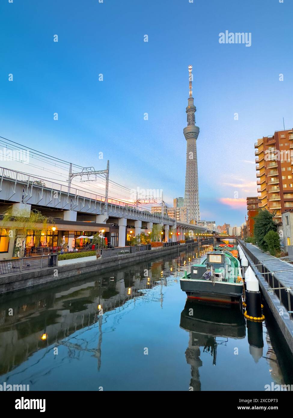 Tokyo Skytree, canal with boat, railway line Stock Photo - Alamy