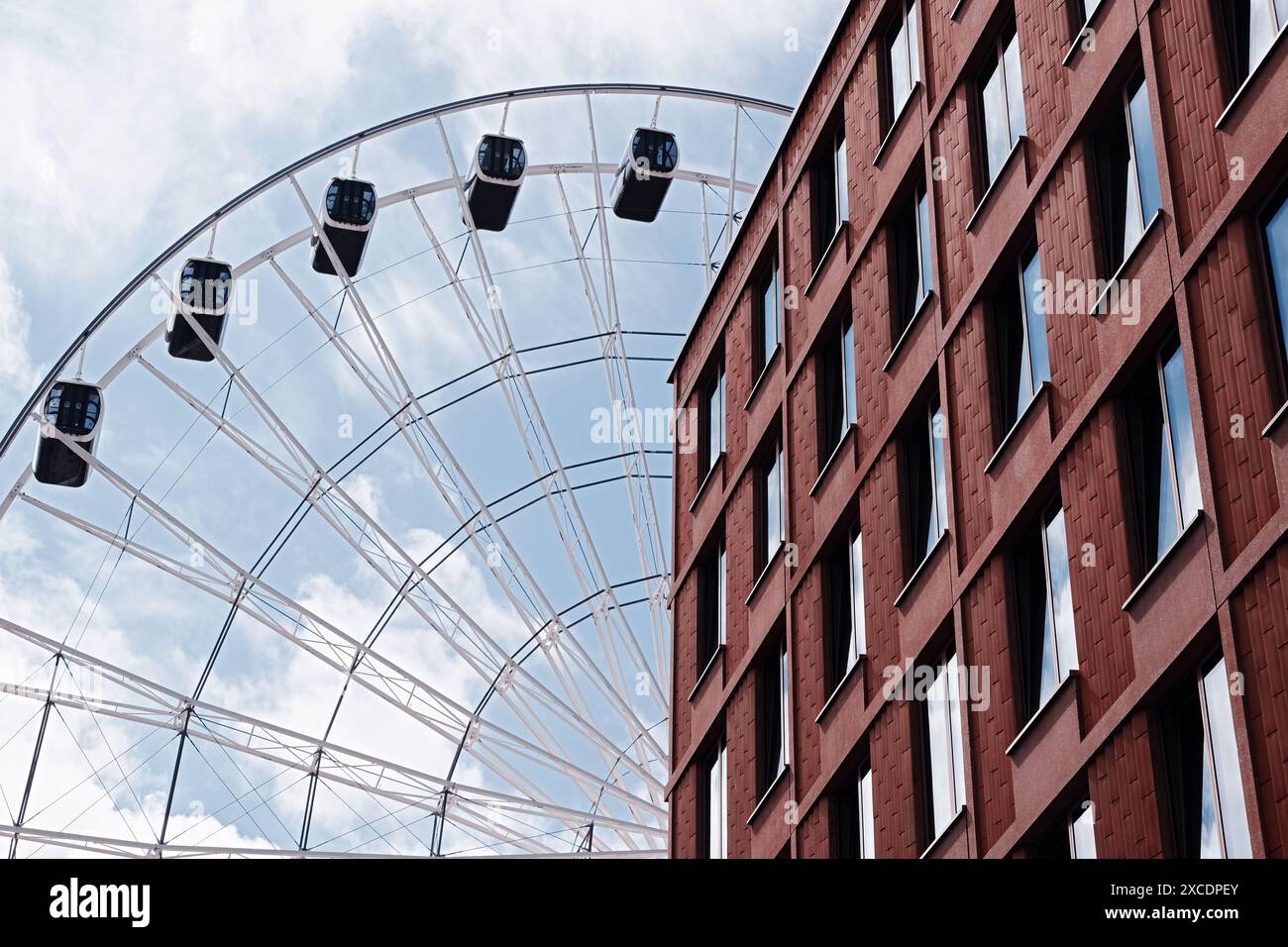 Urban background with ferris wheel and exterior building facade in ...