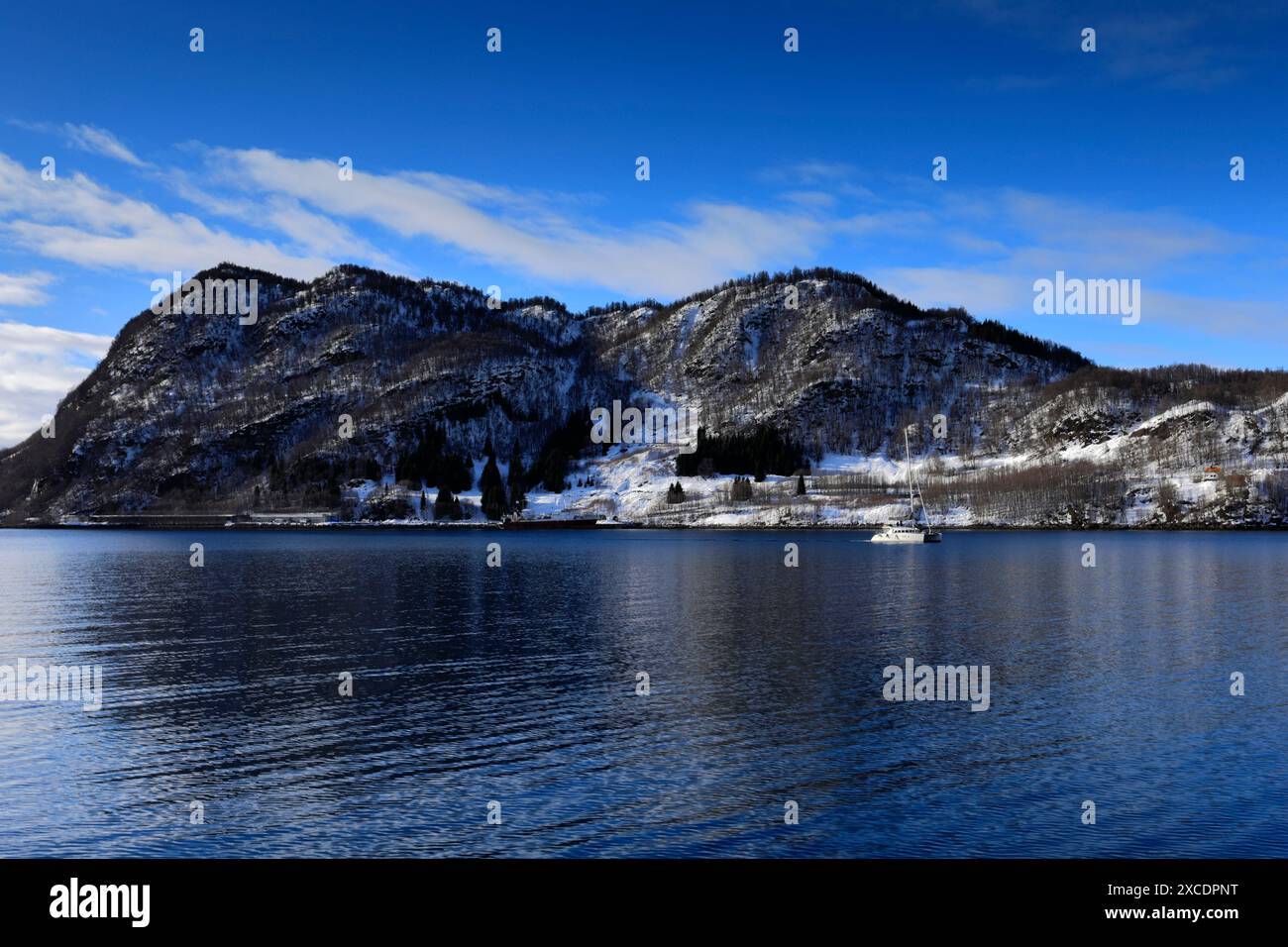 View from a boat of the mountains along Ramfjord, a scenic Fjord south ...