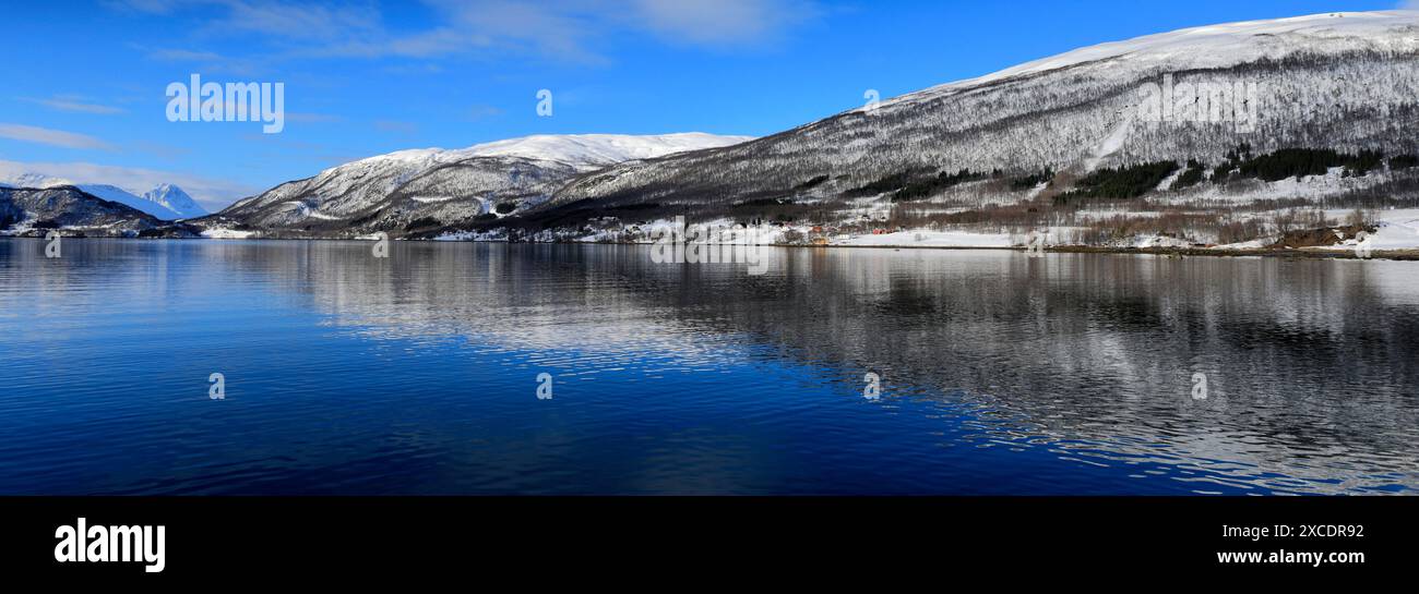 View from a boat of the mountains along Ramfjord, a scenic Fjord south ...