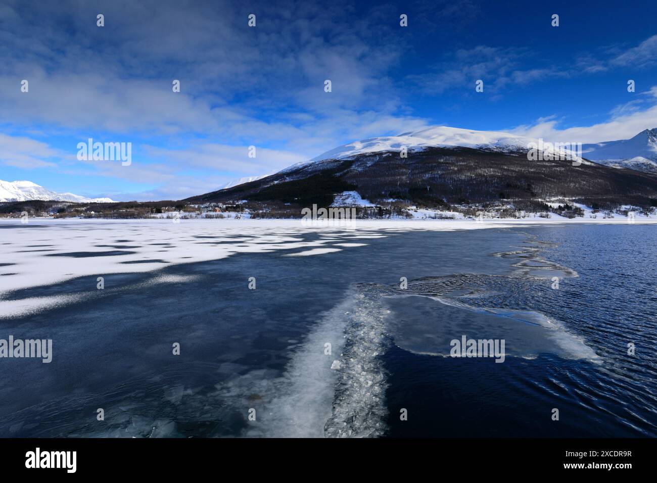 View from a boat of the mountains along Ramfjord, a scenic Fjord south ...