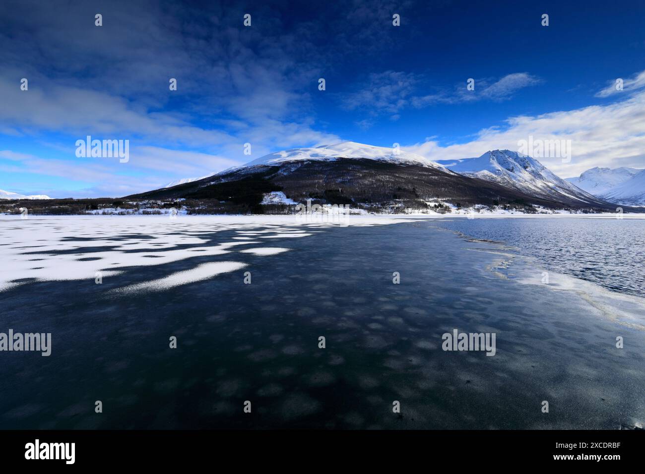 View from a boat of the mountains along Ramfjord, a scenic Fjord south ...