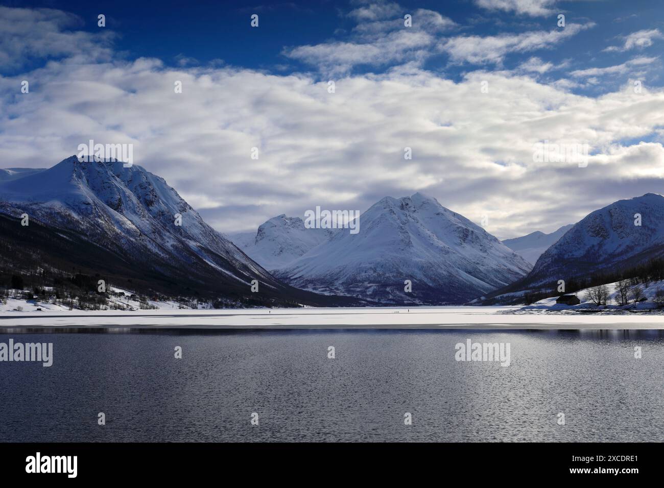 View from a boat of the mountains along Ramfjord, a scenic Fjord south ...