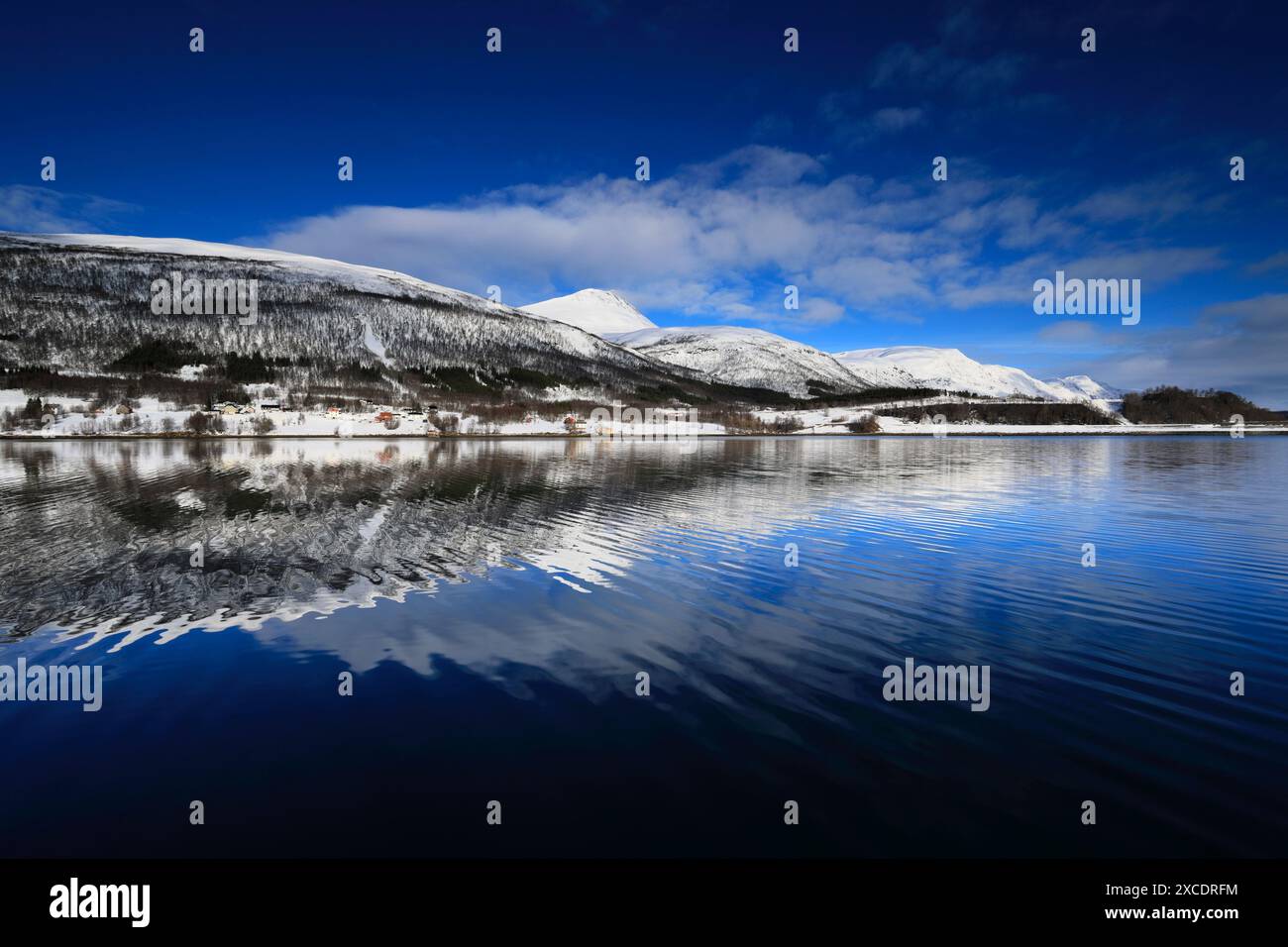 View from a boat of the mountains along Ramfjord, a scenic Fjord south ...