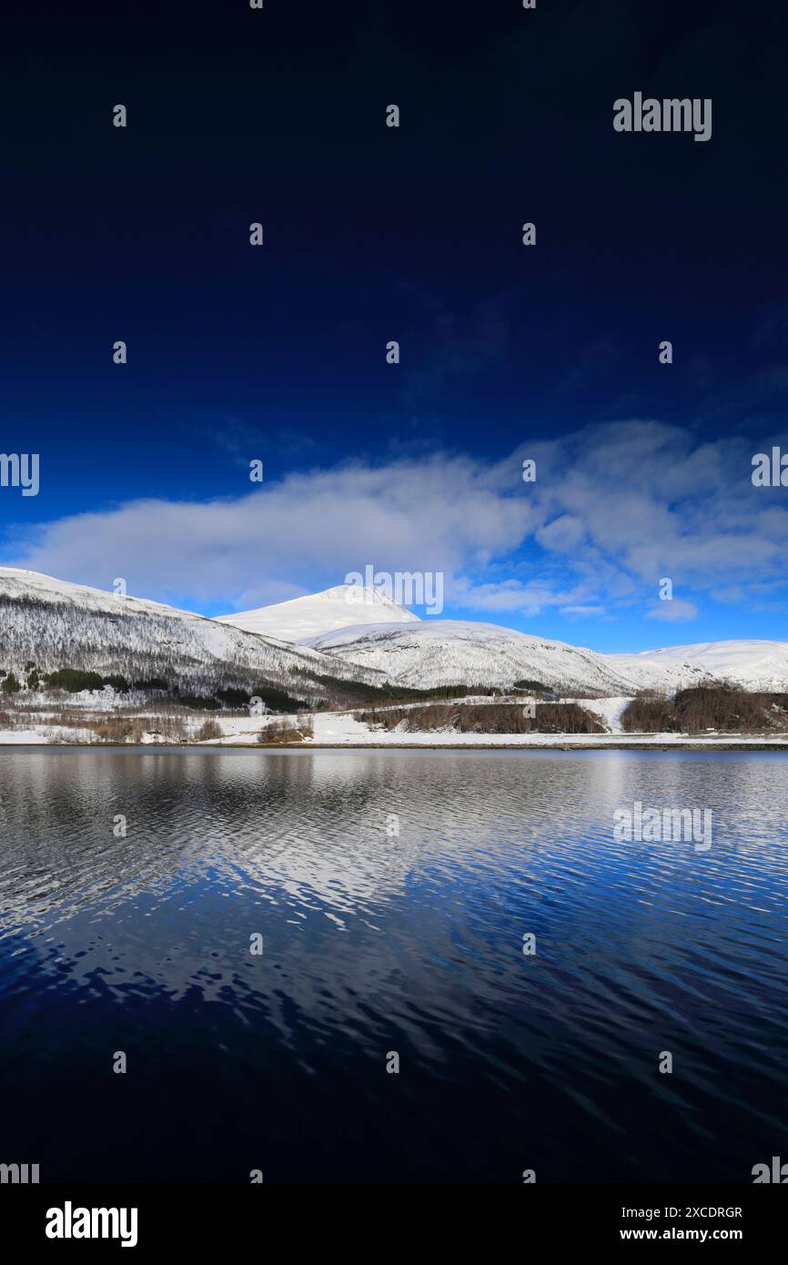View from a boat of the mountains along Ramfjord, a scenic Fjord south ...