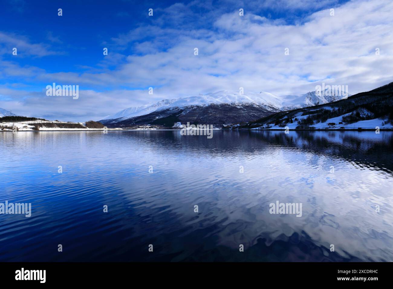 View from a boat of the mountains along Ramfjord, a scenic Fjord south ...