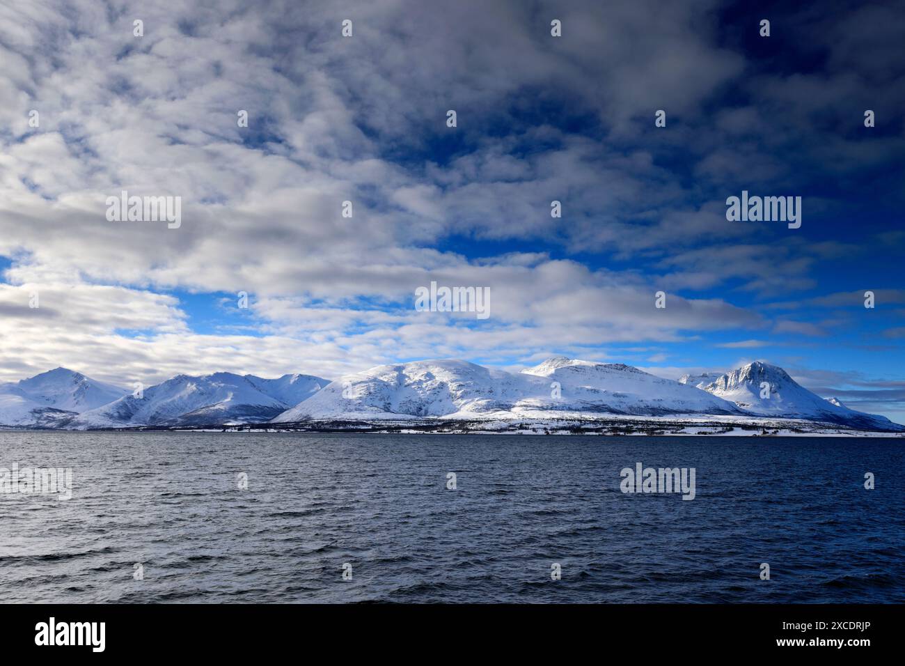 View from a boat of the mountains along Ramfjord, a scenic Fjord south ...