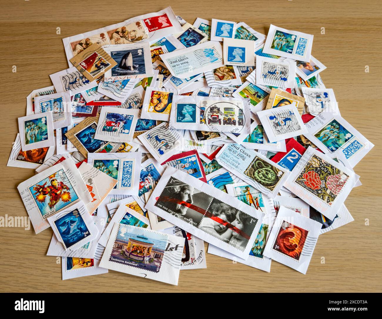 A collection or arrangement of used and watermarked British Royal Mail ...
