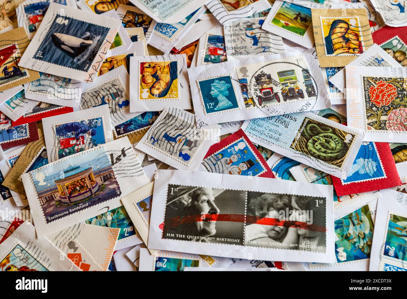 A collection or arrangement of used and watermarked British Royal Mail ...