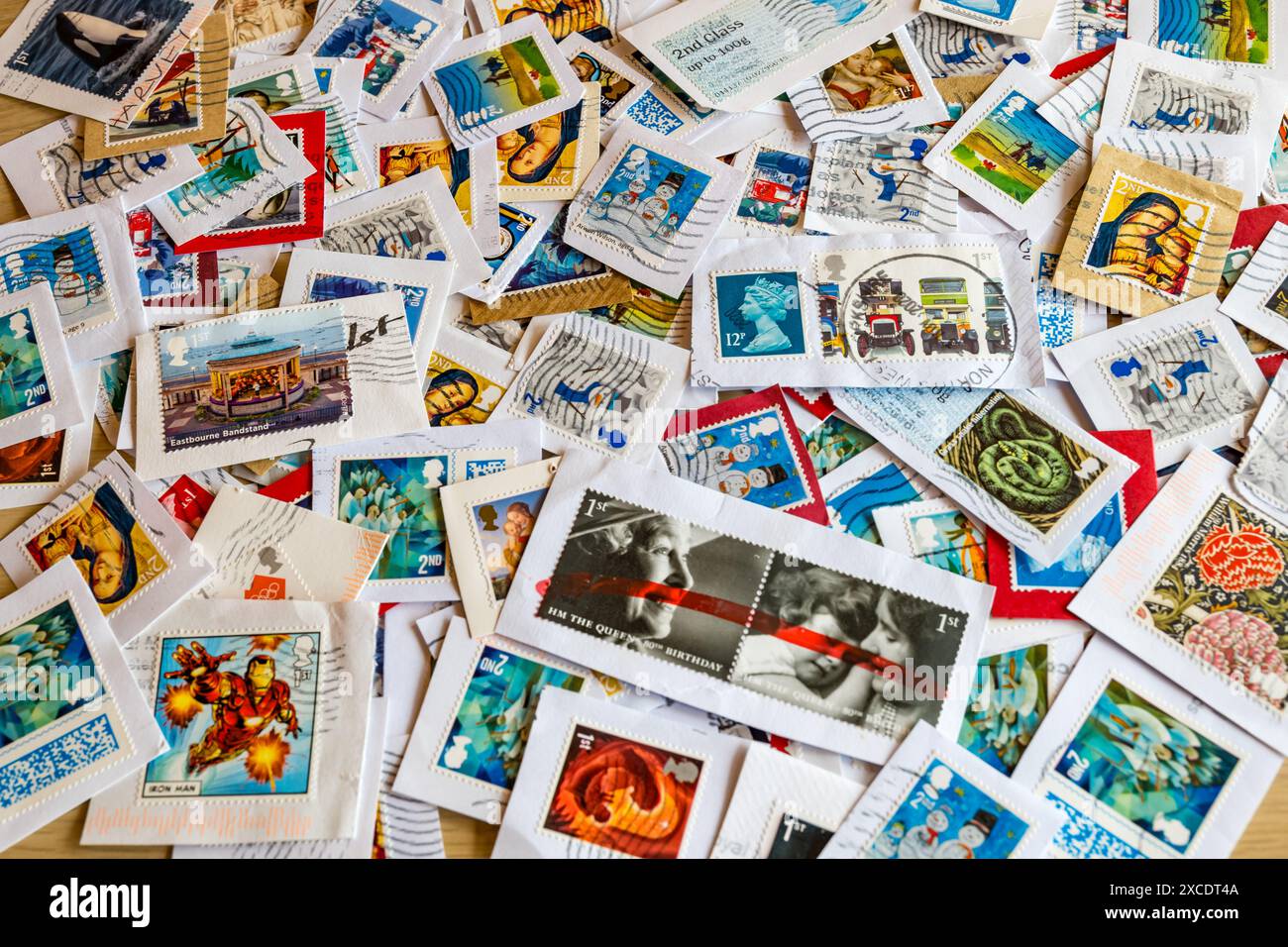 A collection or arrangement of used and watermarked British Royal Mail ...