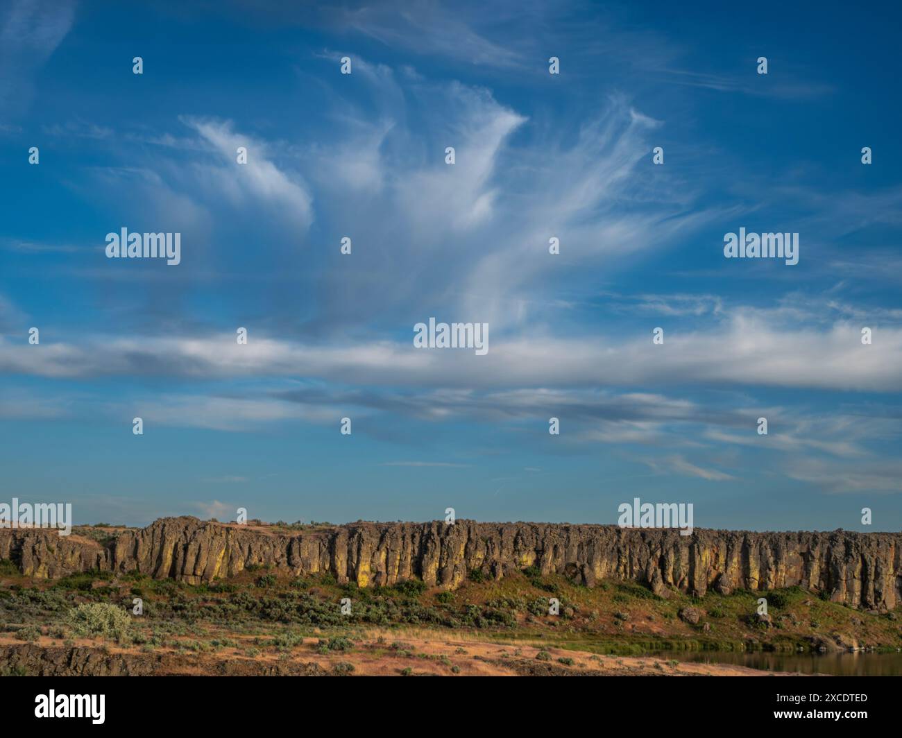 WA25422-00...WASHINGTON - Clouds above Canal Lake surrounded by buttes ...