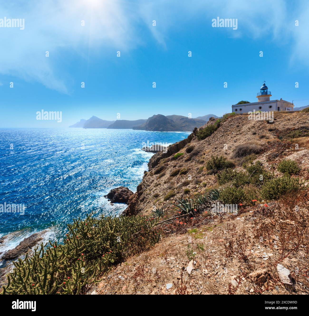 Mediterranean sea summer rocky coast view and lighthouse El hoyo del ...