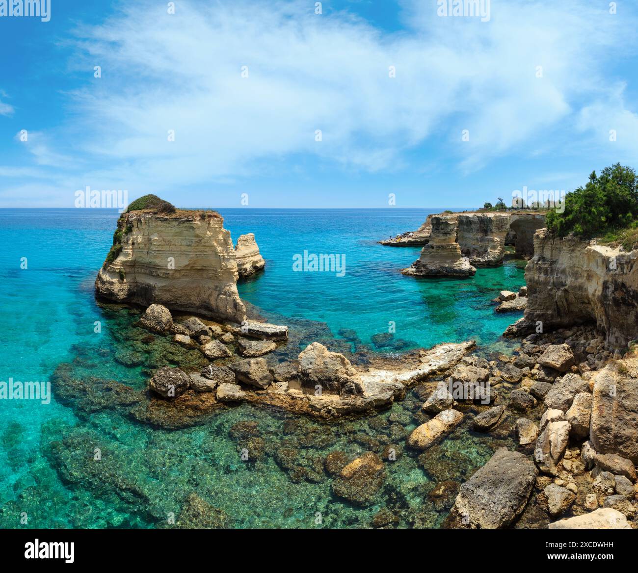 Picturesque seascape with cliffs, rocky arch and stacks (faraglioni ...
