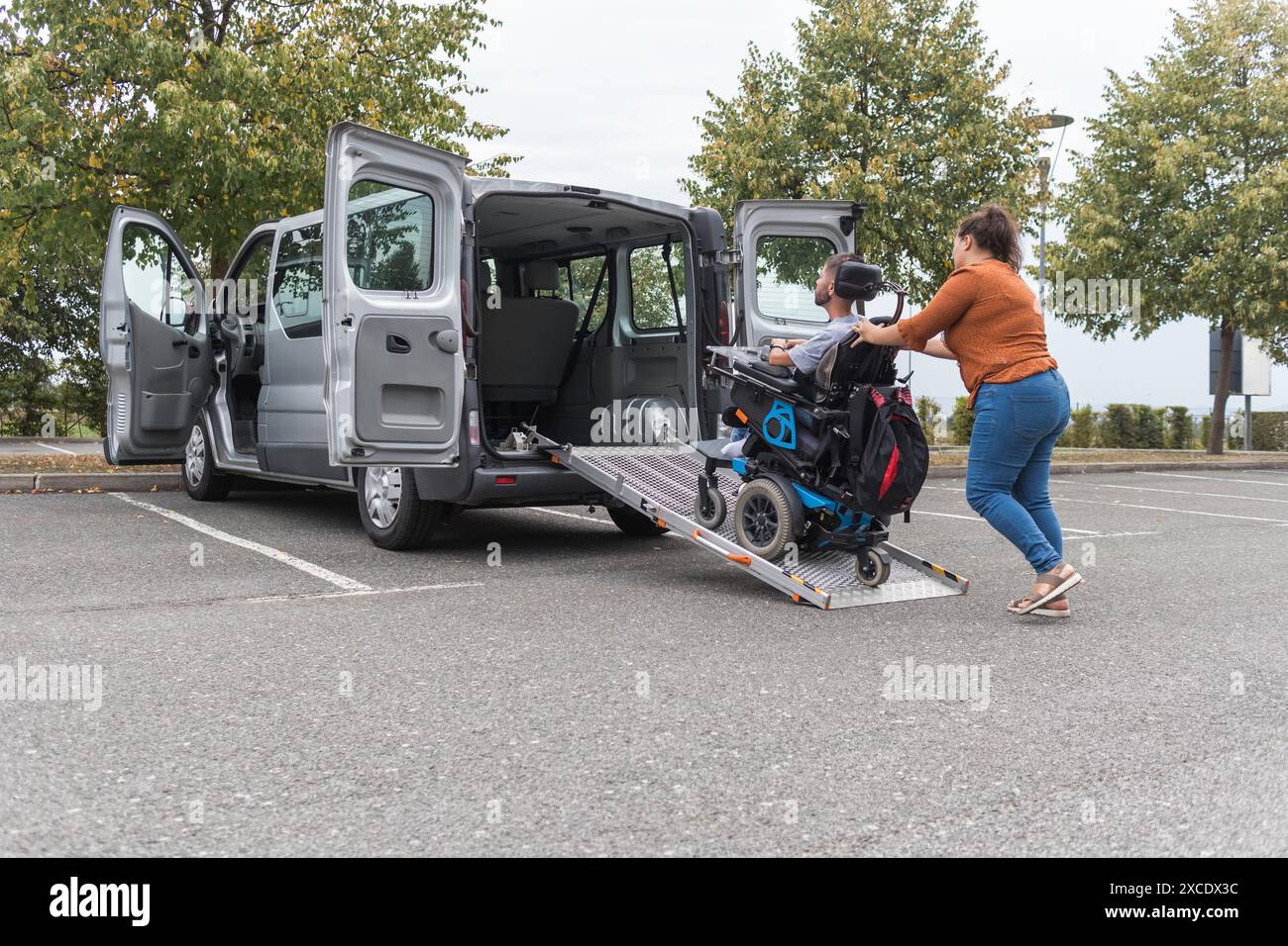Push wheelchair up ramp hi-res stock photography and images - Alamy
