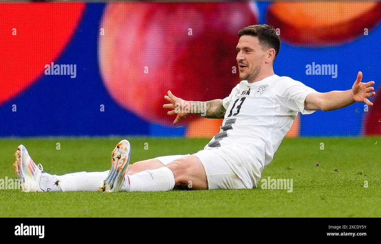 Slovenia's Erik Janza celebrates after scoring their side's first goal ...
